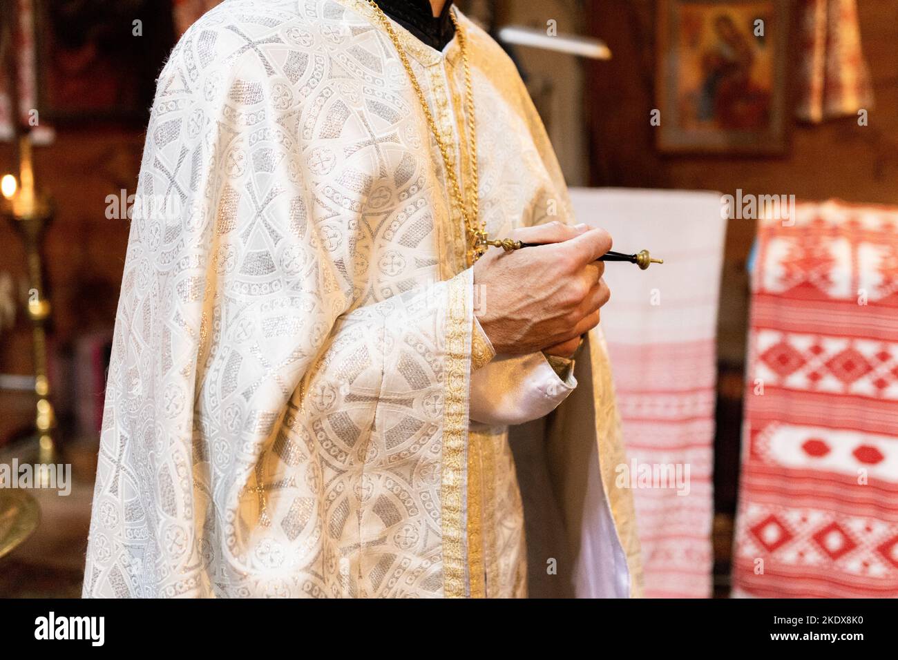 a priest in the old church at the baptism Stock Photo - Alamy