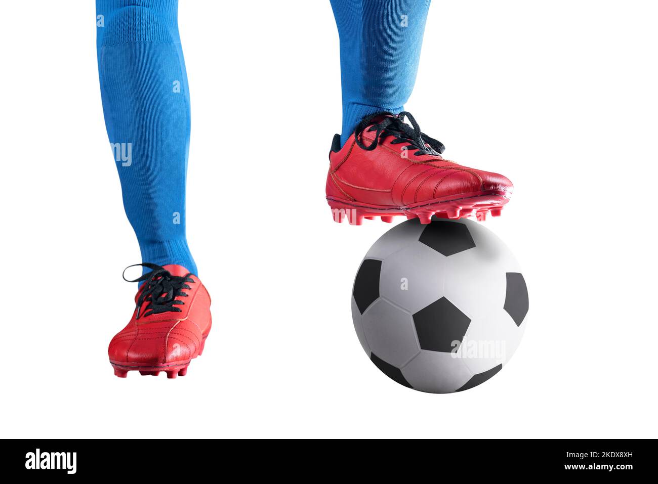 Football player man in a blue jersey with the ball posing isolated over ...