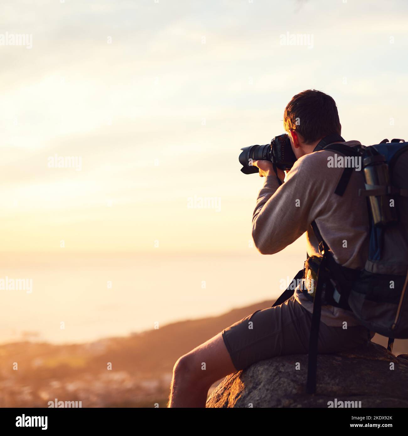 Time spent in nature is never wasted. a young photographer taking a ...