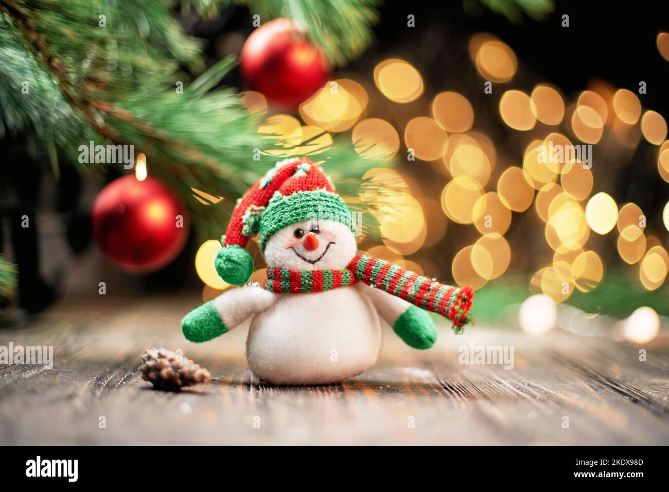 toy snowman on the background of Christmas lights Stock Photo - Alamy
