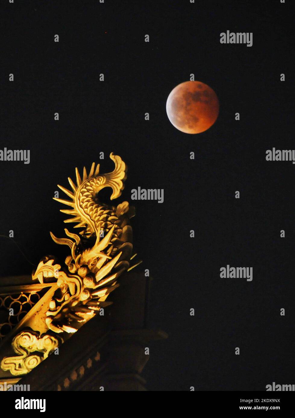 The blood moon is seen during a total lunar eclipse in Shanghai, China ...