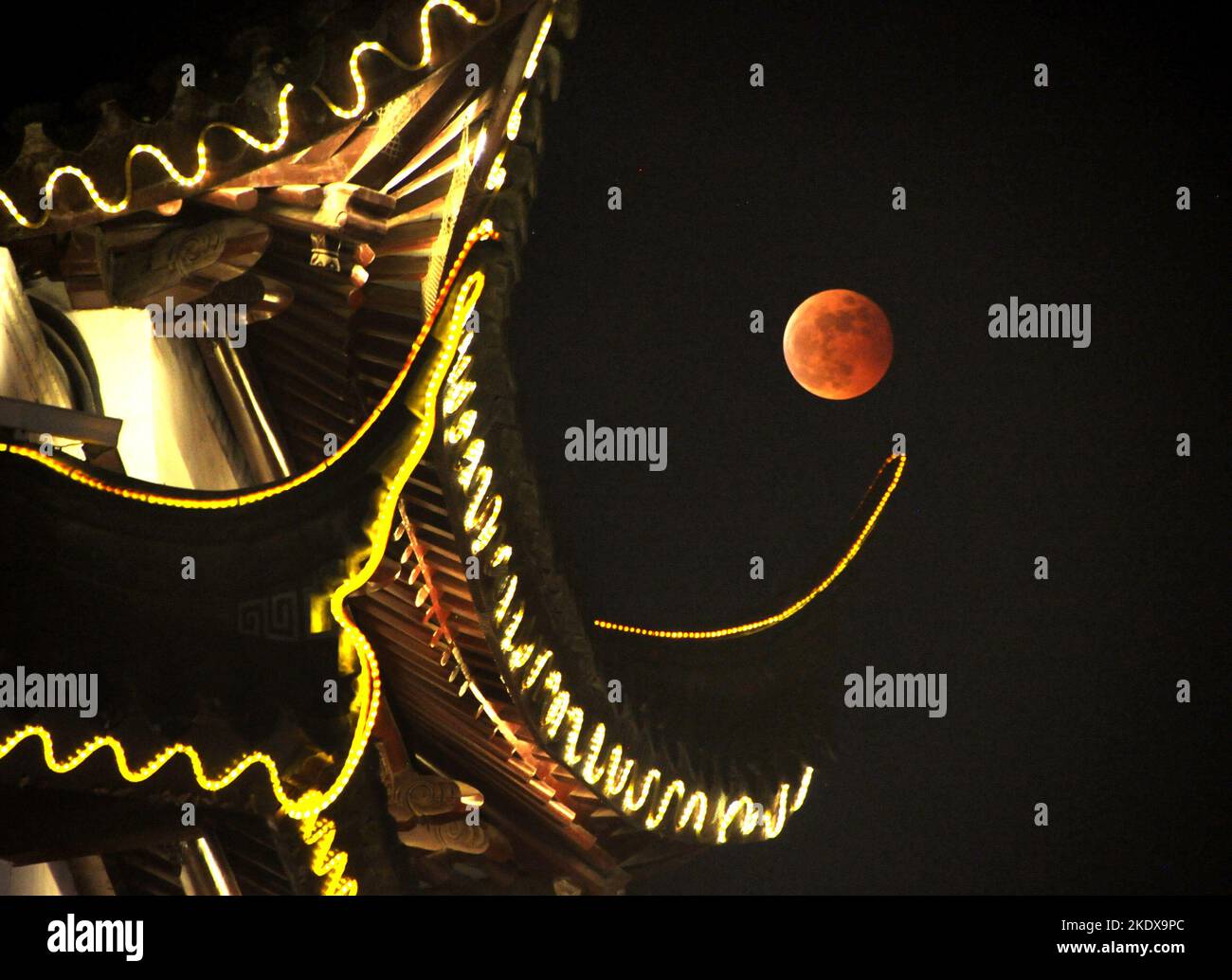 The blood moon is seen during a total lunar eclipse in Shanghai, China ...