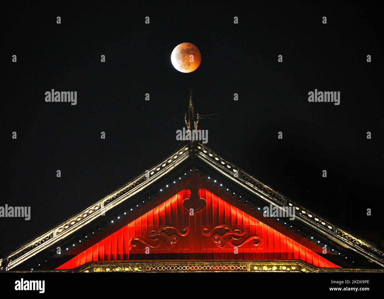 The blood moon is seen during a total lunar eclipse in Shanghai, China ...