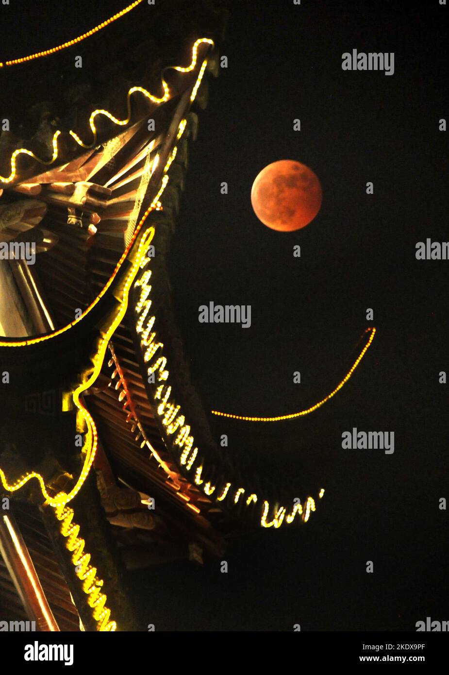 The blood moon is seen during a total lunar eclipse in Shanghai, China ...