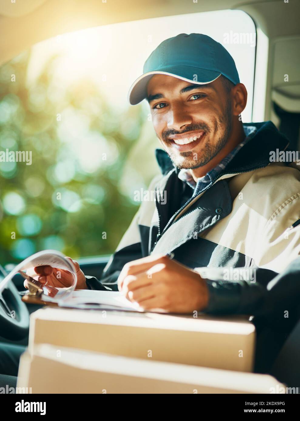 Ill be delivering your parcel next. Portrait of a courier making ...