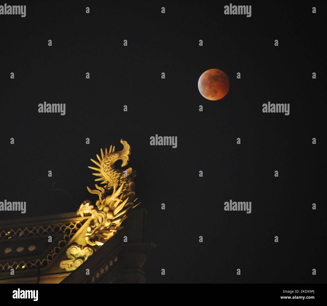 The blood moon is seen during a total lunar eclipse in Shanghai, China ...