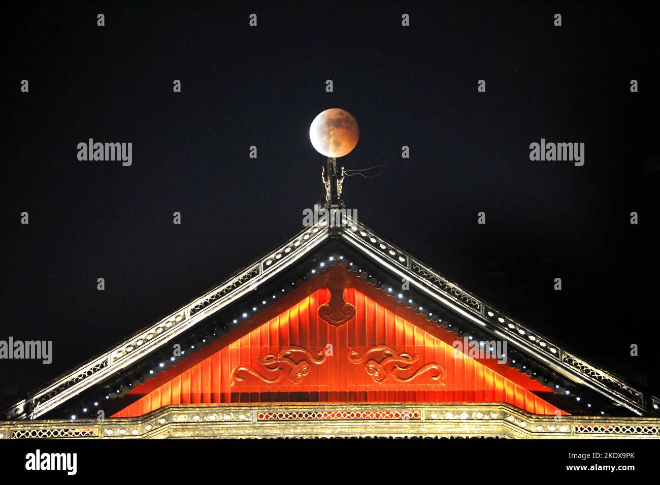The blood moon is seen during a total lunar eclipse in Shanghai, China ...