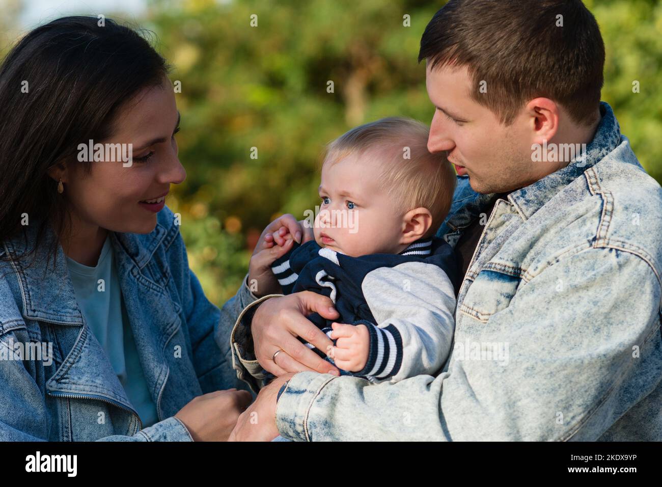 Lovely caring caucasian white family. Mother, dad and kid baby son ...