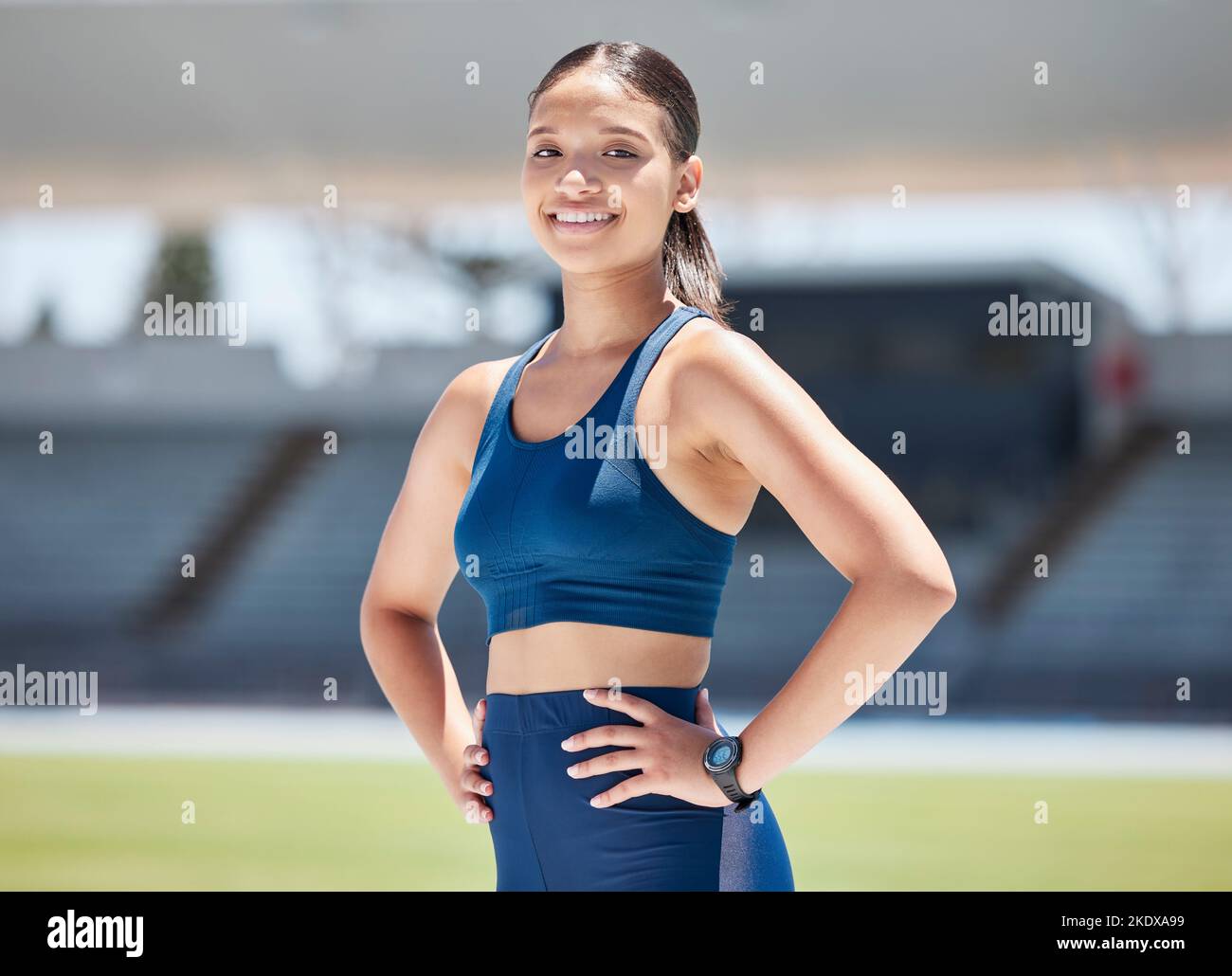 Portrait, woman and athlete on stadium running track for sports race ...