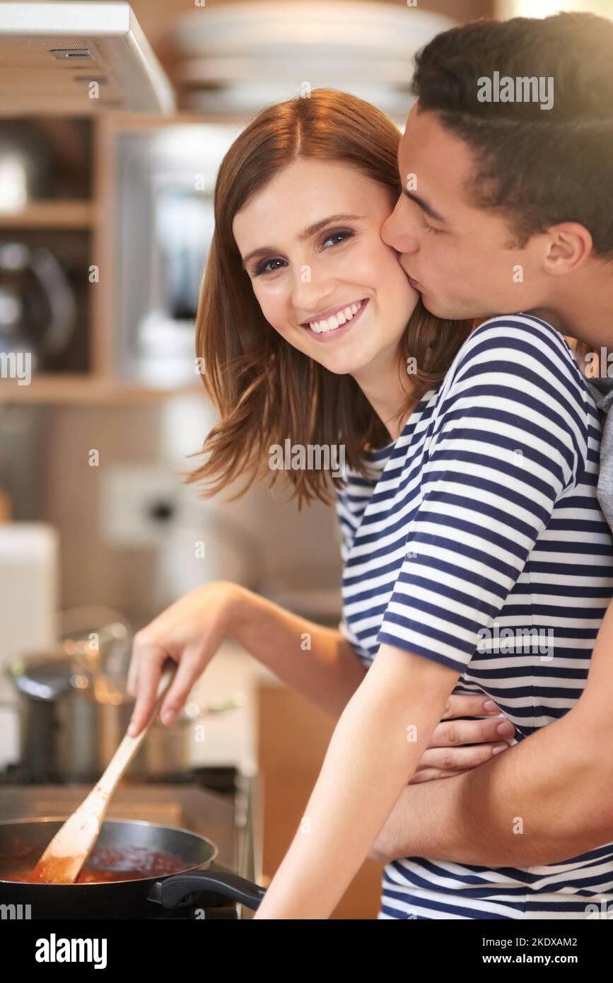 The secret ingredient is love. Portrait of an affectionate young couple ...