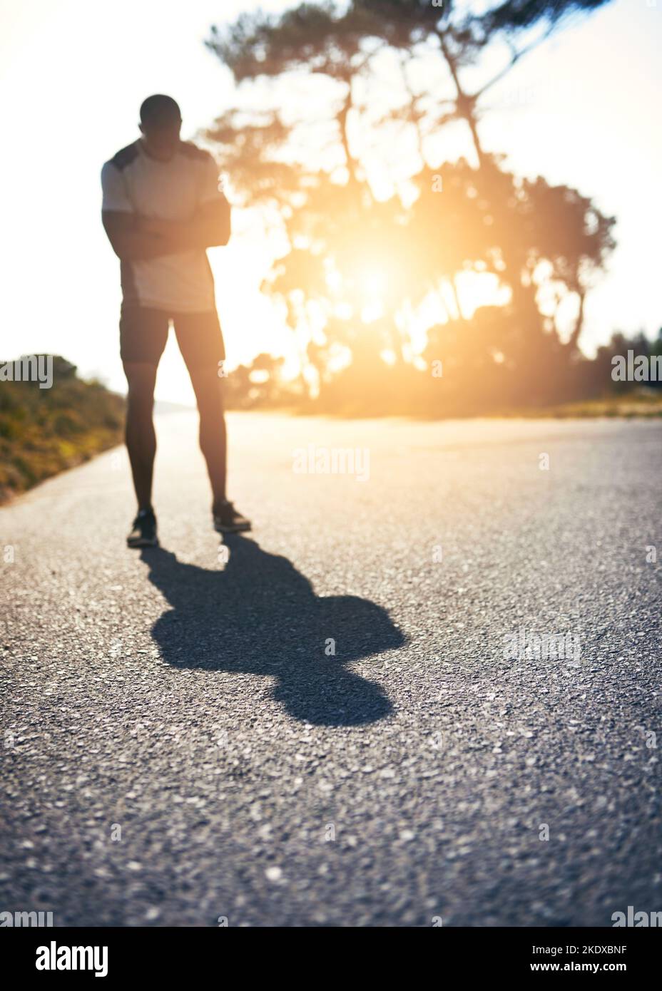 Step out of your shadow to find your strength. a young man looking ...