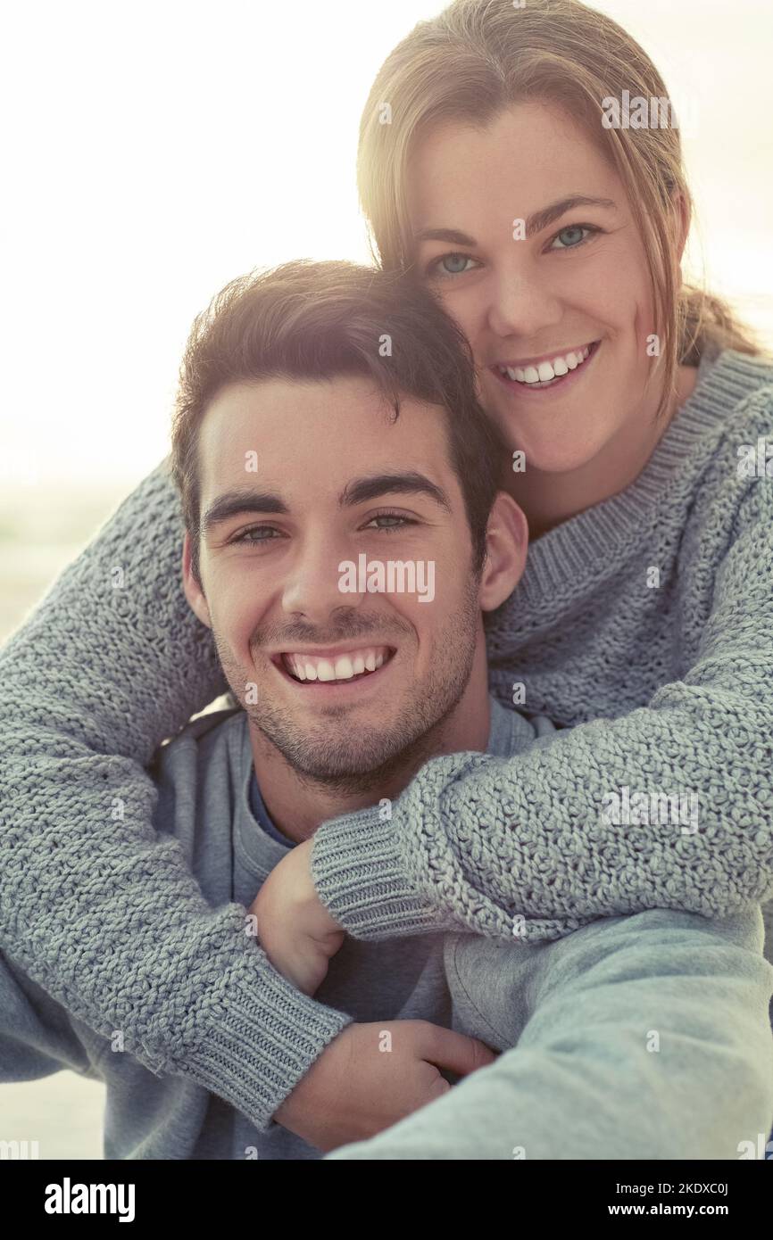Lucky in love. Portrait of a happy young man giving his girlfriend a ...