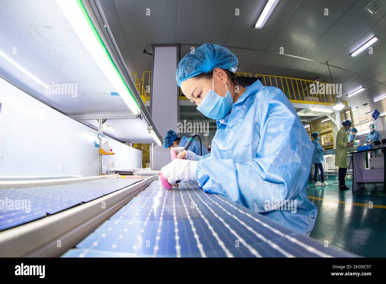 NANTONG, CHINA - NOVEMBER 9, 2022 - Workers make solar photovoltaic ...