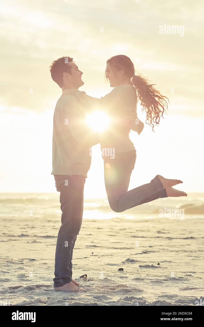 Love and fun in the sun. a young couple relaxing on the beach together ...