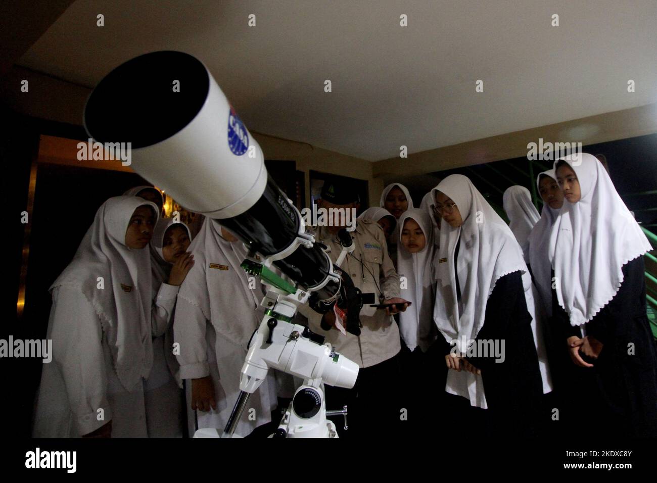 Sukoharjo, Indonesia. 8th Nov, 2022. A teacher and his students observe ...