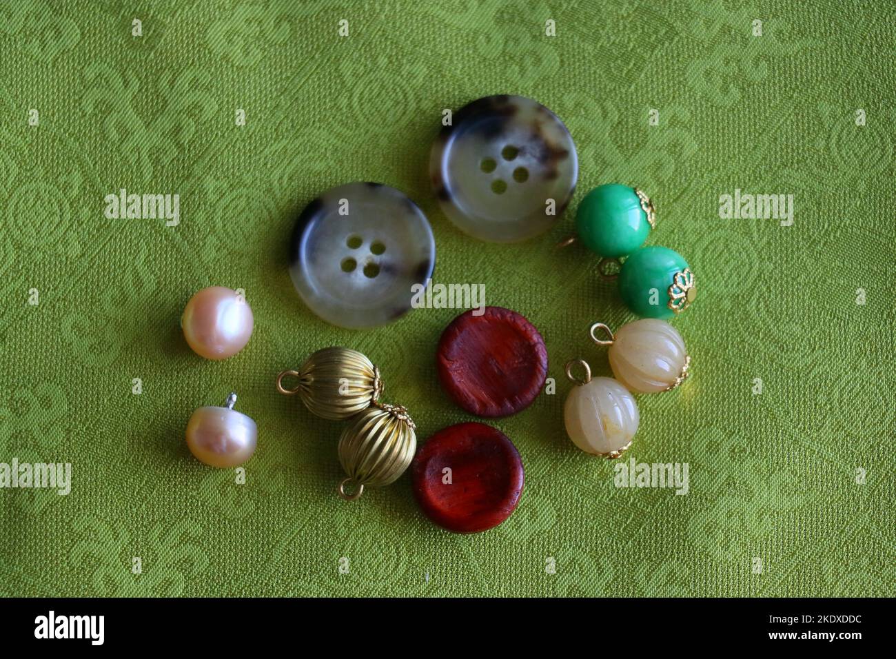 Chinese button in silk background Stock Photo - Alamy