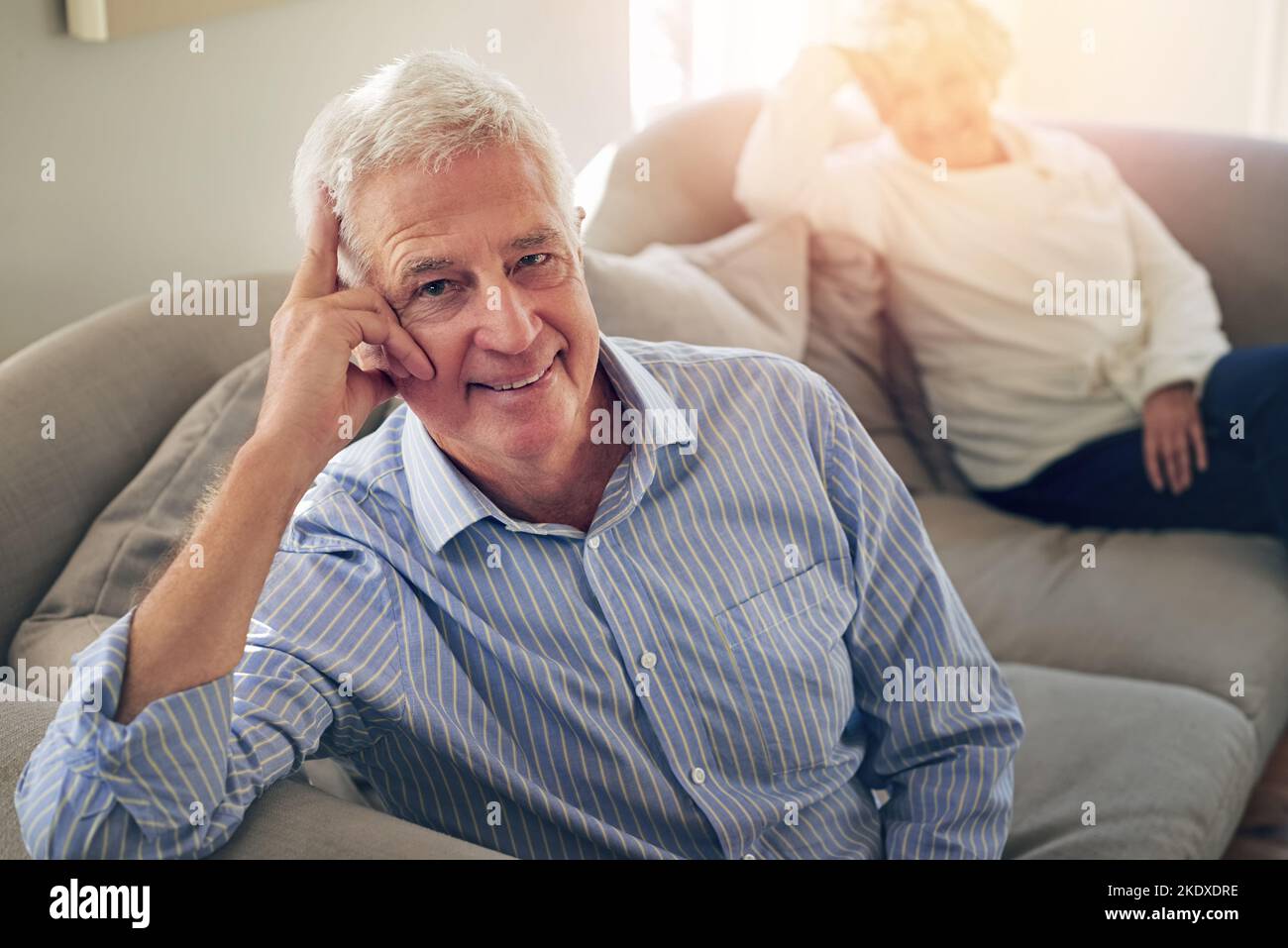 Retirement has its perks. Portrait of a senior man relaxing at home ...