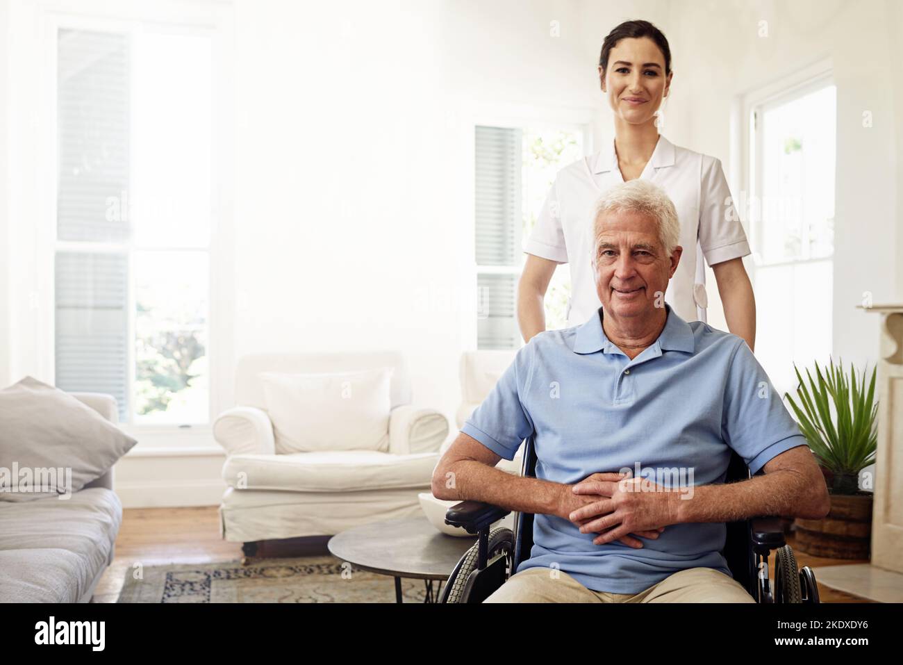 Caregiving is her passion. Portrait of a smiling caregiver and a senior ...