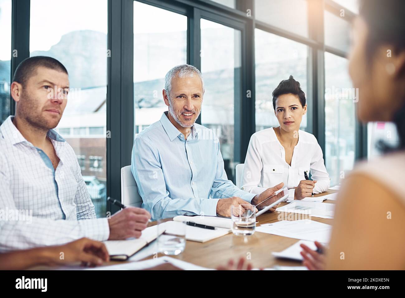 Theyre hooked by her amazing ideas. a group of colleagues having a ...