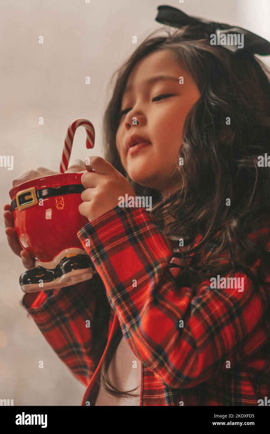 Happy japan little girl dreamer waiting miracle Santa enjoy sweets near ...