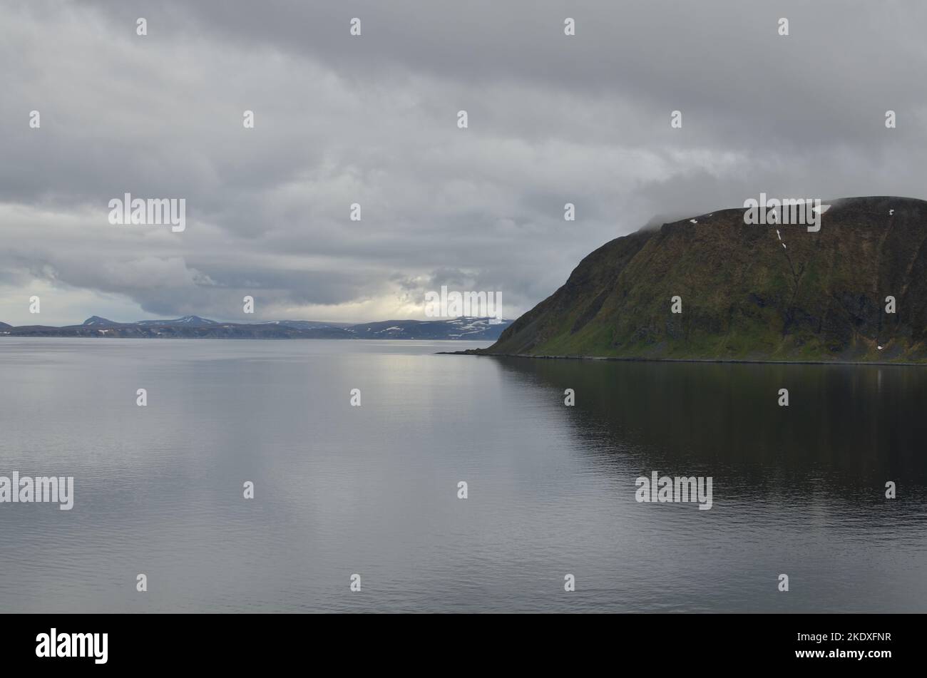 cloudy Fjord Norway ocean mirroring cold water Stock Photo - Alamy