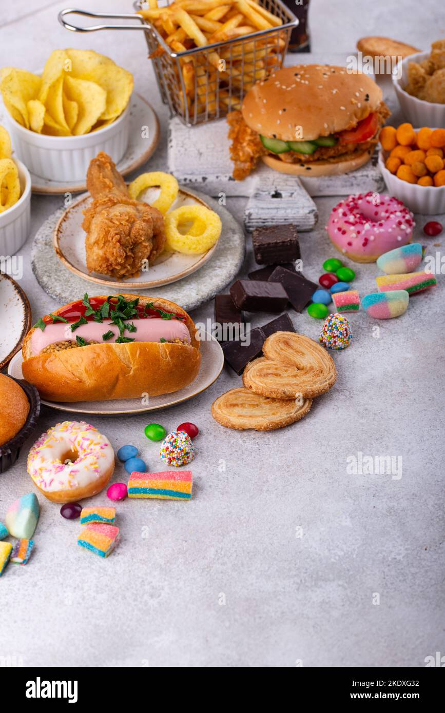 Assortment of various unhealthy junk food Stock Photo - Alamy