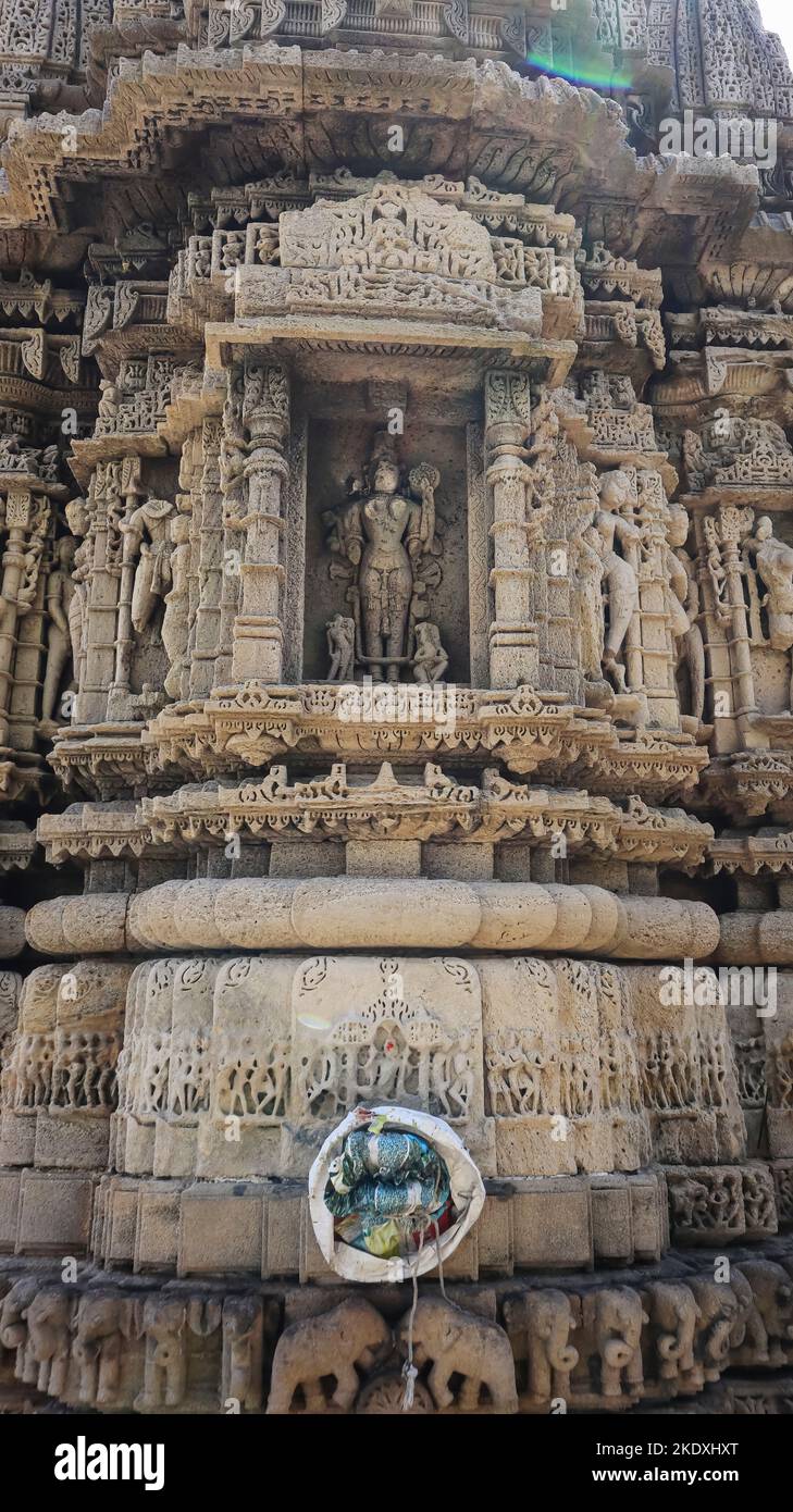 Sculptures of god and goddesses along with male and female figures on ...