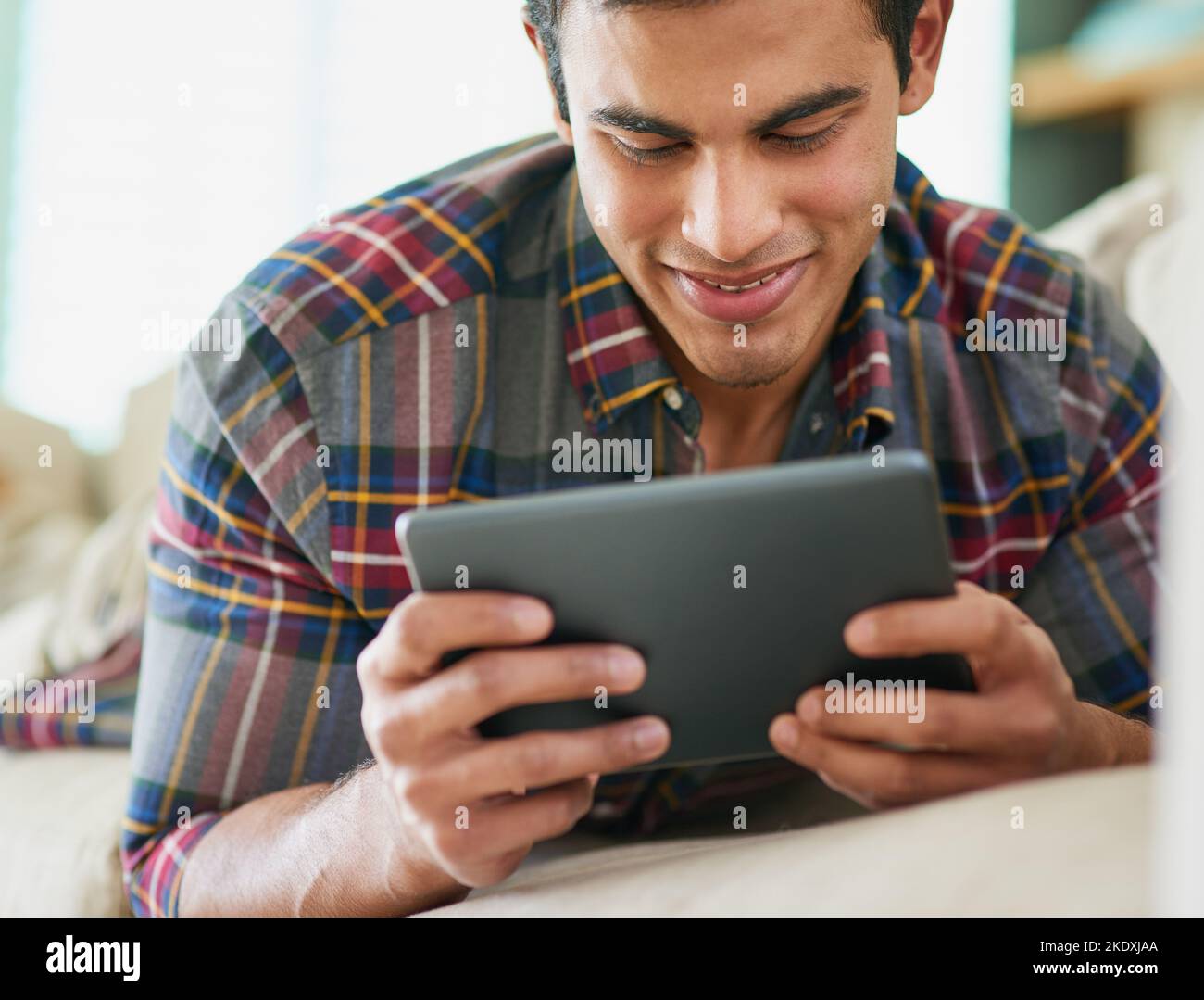 His notifications are going crazy. a handsome young man using his ...