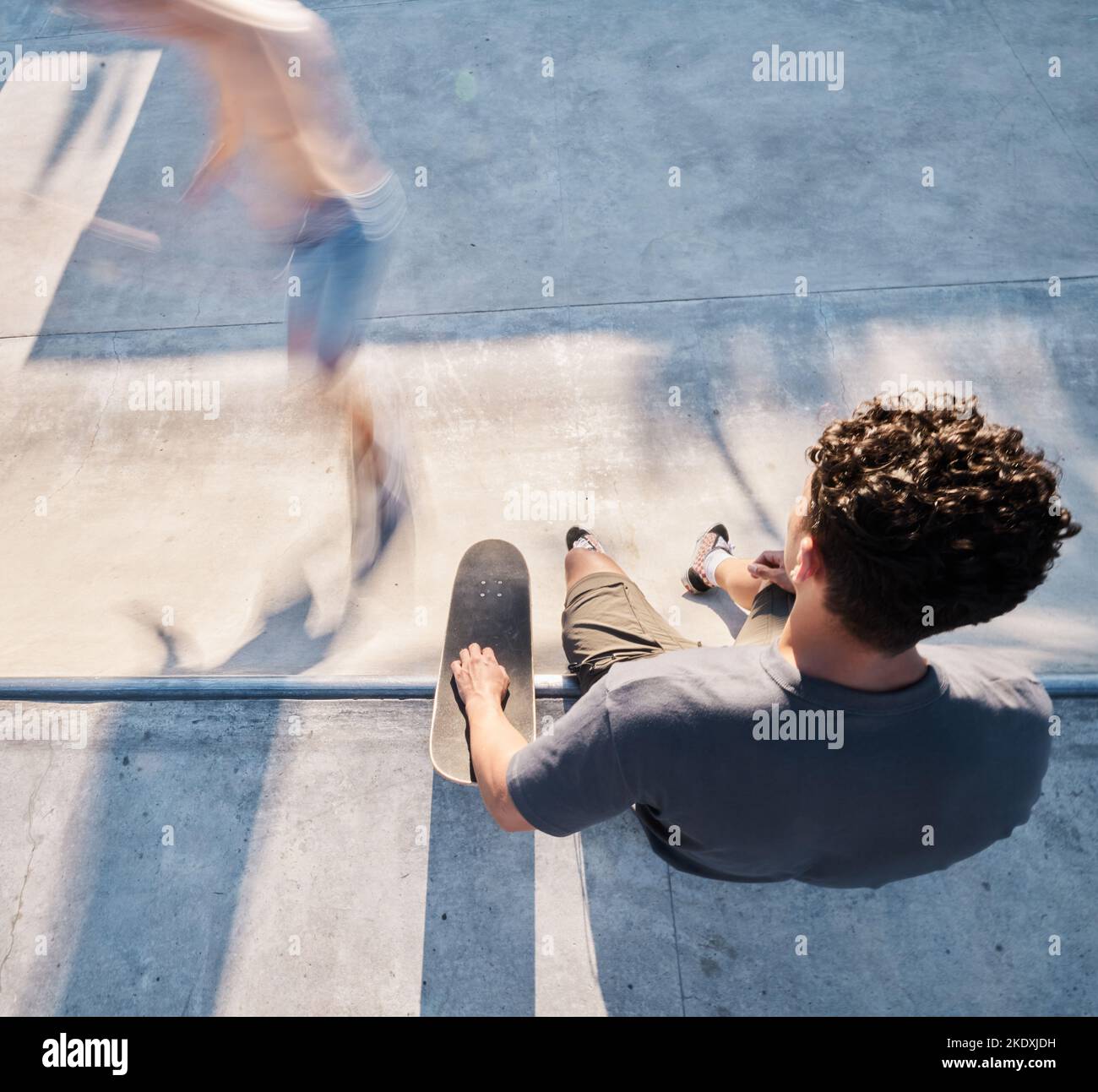 Skate park, top view and man with a skateboard in the city street for ...