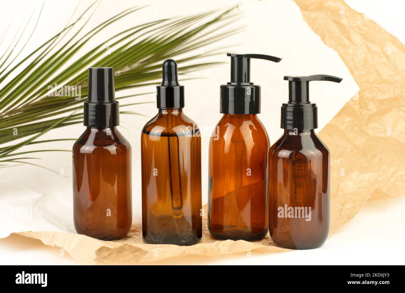 Transparent brown bottles with cosmetics against the background of ...
