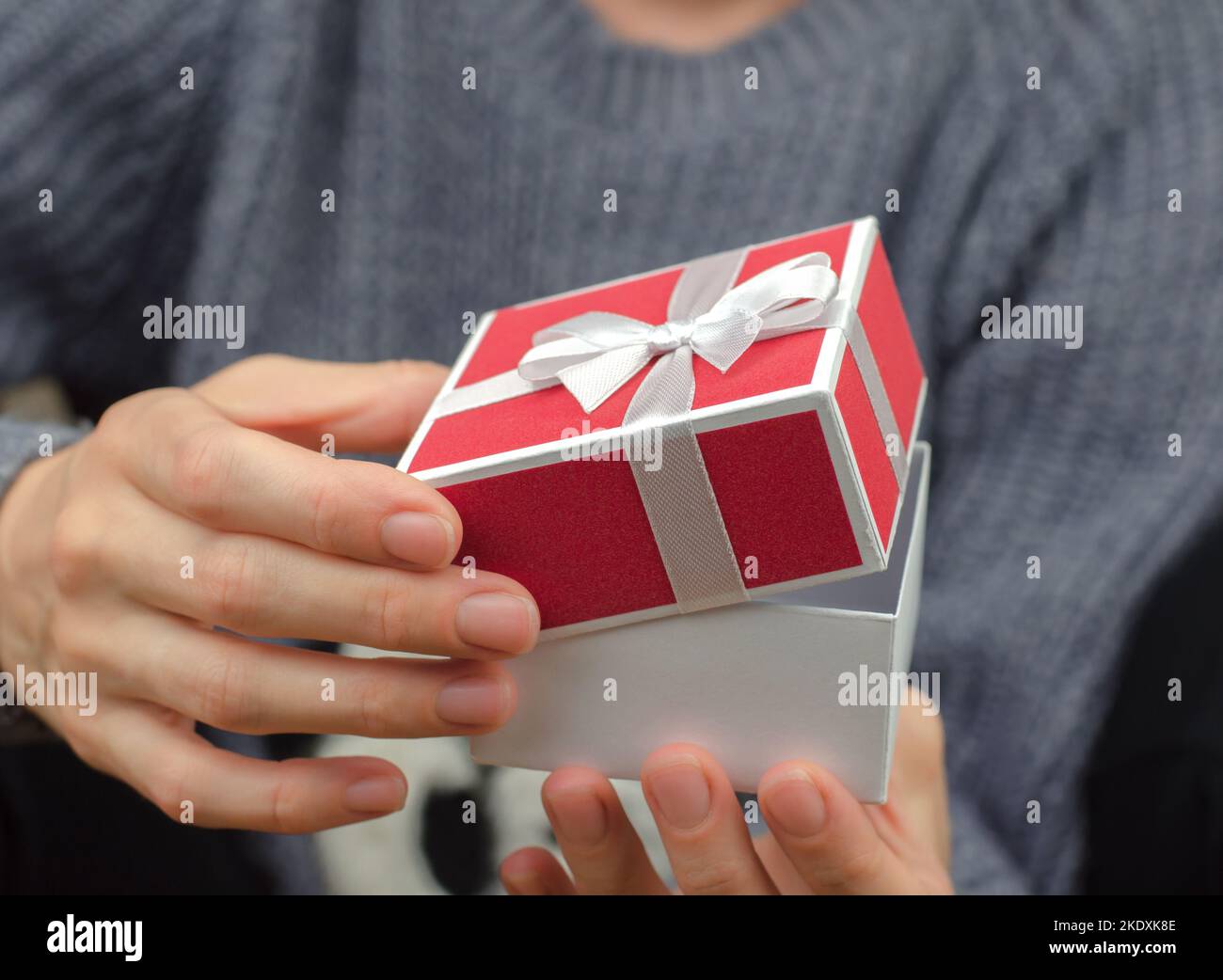 Lady opening box new hi-res stock photography and images - Alamy
