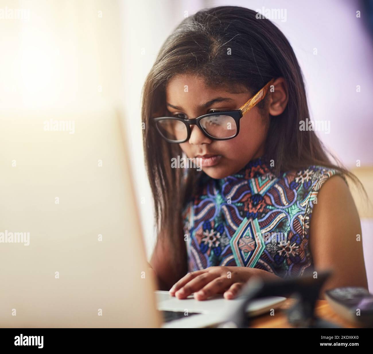 Technology is a great educational tool. a cute little girl using a ...