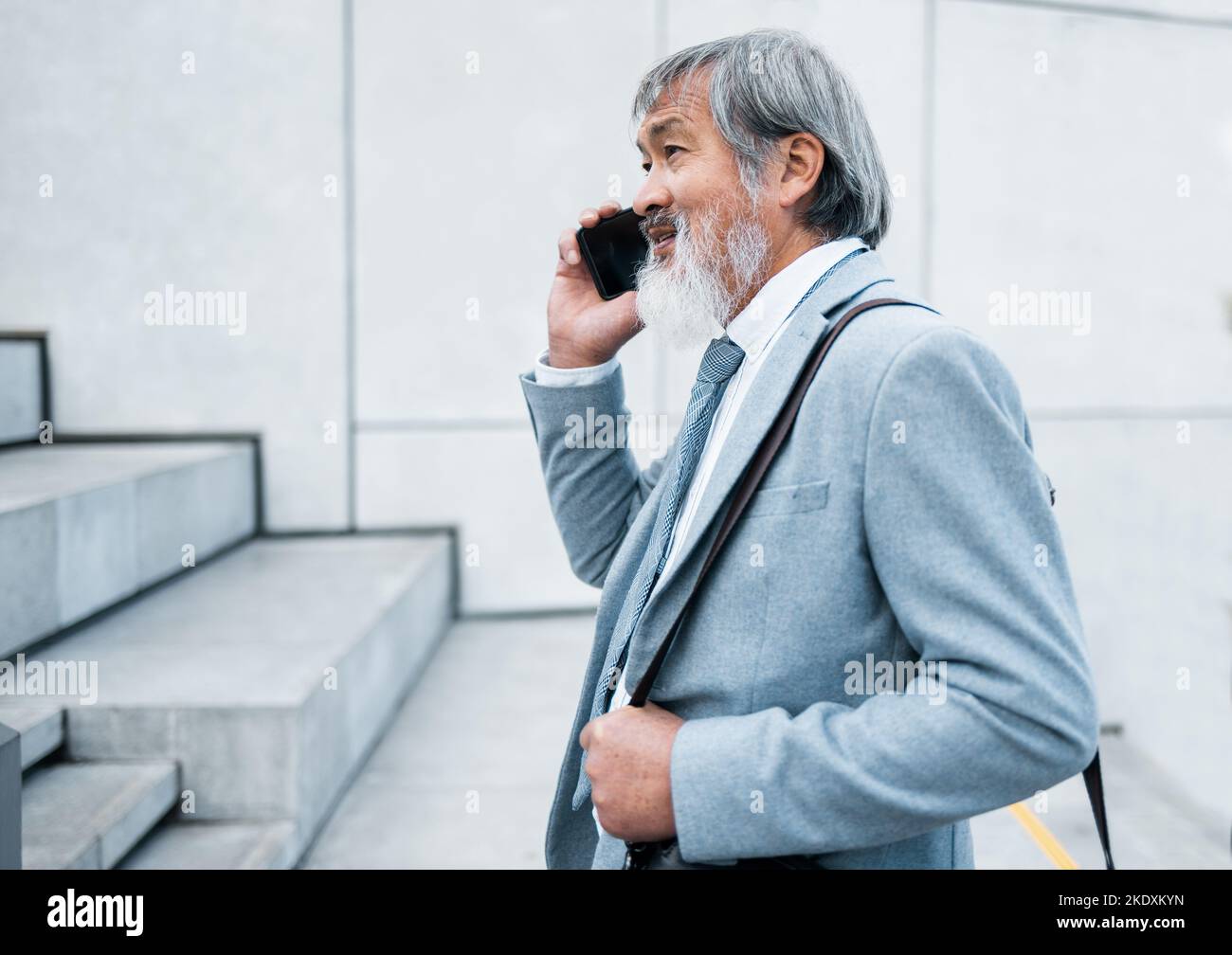 Asian man, business leader and phone call for marketing planning ...