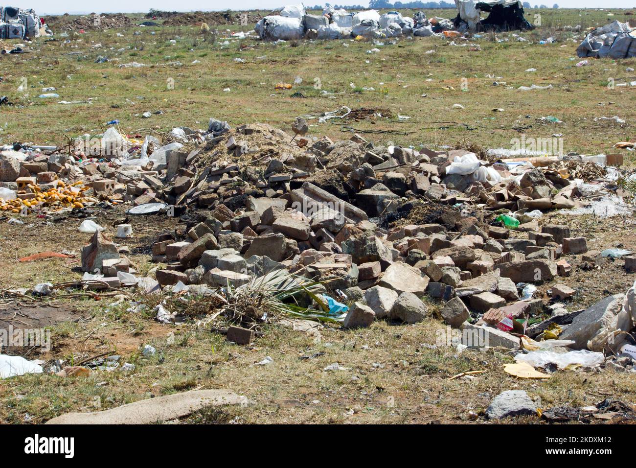 stock photo of building rubble and garbage collection bags and other ...