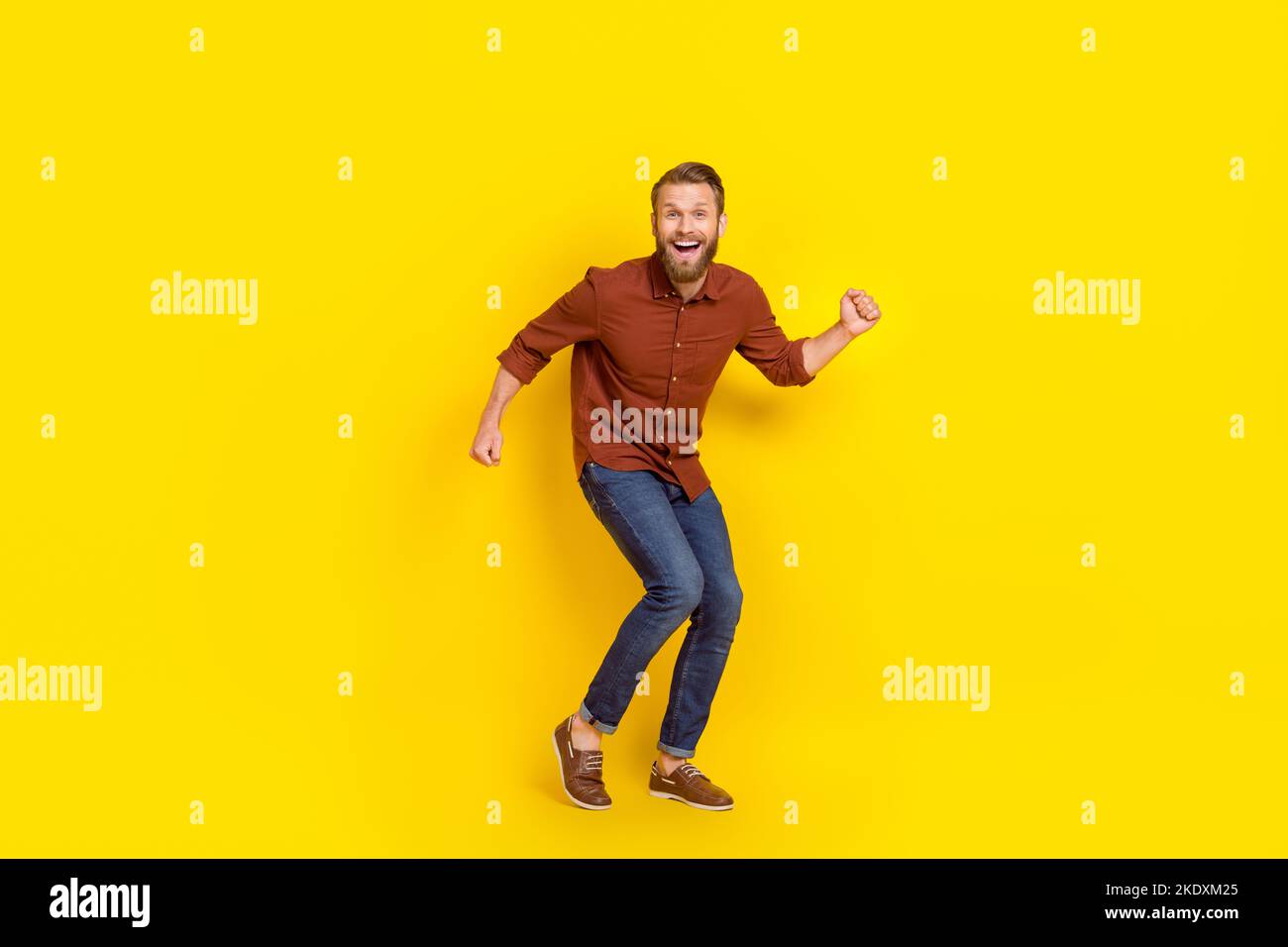 Full size portrait of overjoyed cheerful man chilling dancing clubbing ...