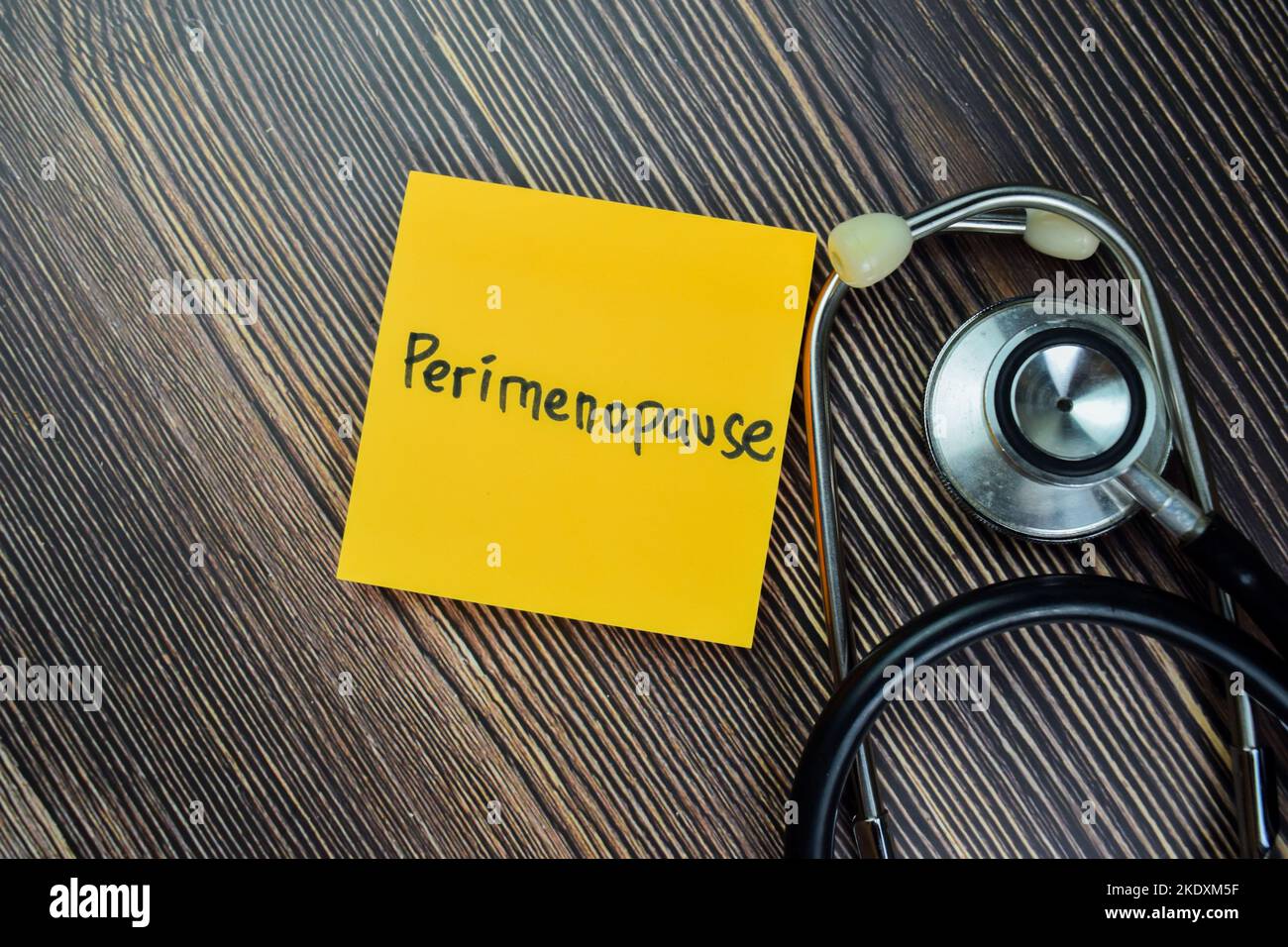 Concept of Perimenopause write on sticky notes with stethoscope ...