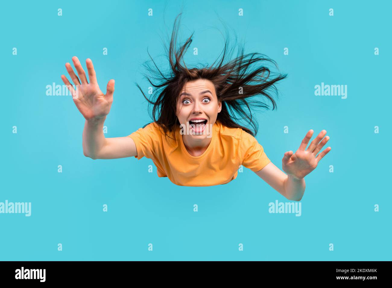 Photo of overjoyed astonished girl flying high cosmic space impressed ...