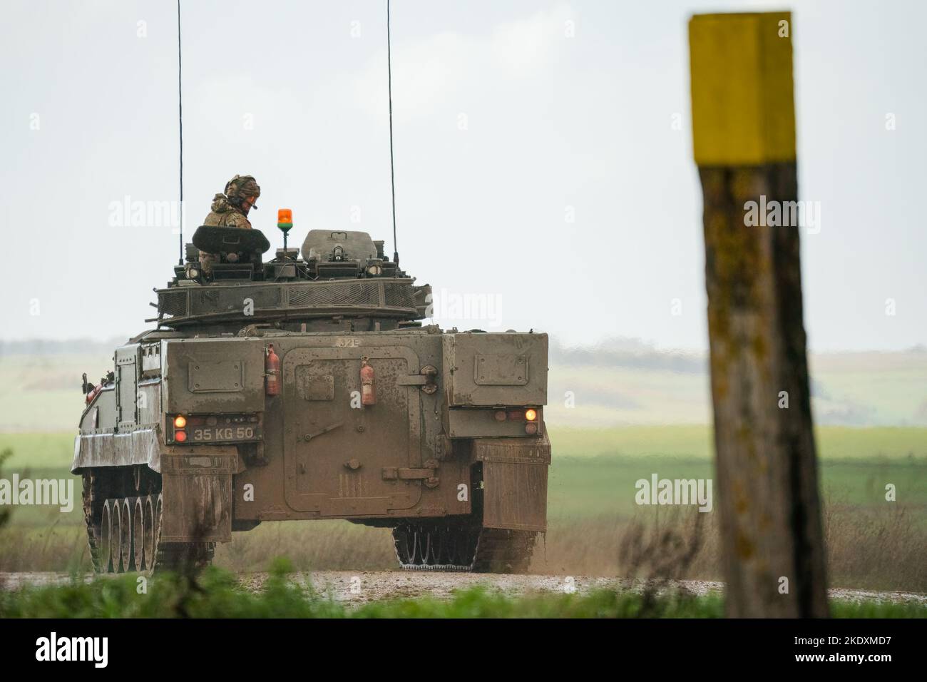 British army Warrior FV510 Fighting Vehicle crossing a sign posted road ...