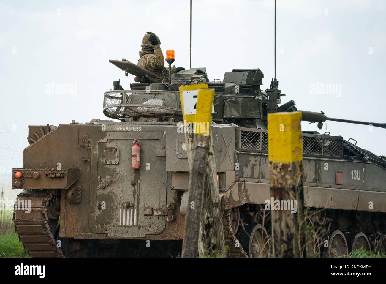 British army Warrior FV510 Fighting Vehicle crossing a sign posted road ...