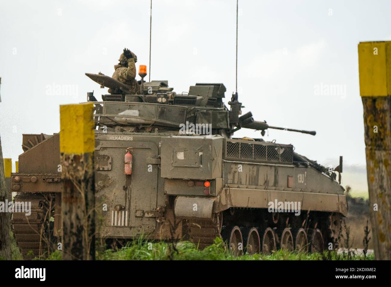 British army Warrior FV510 Fighting Vehicle crossing a sign posted road ...