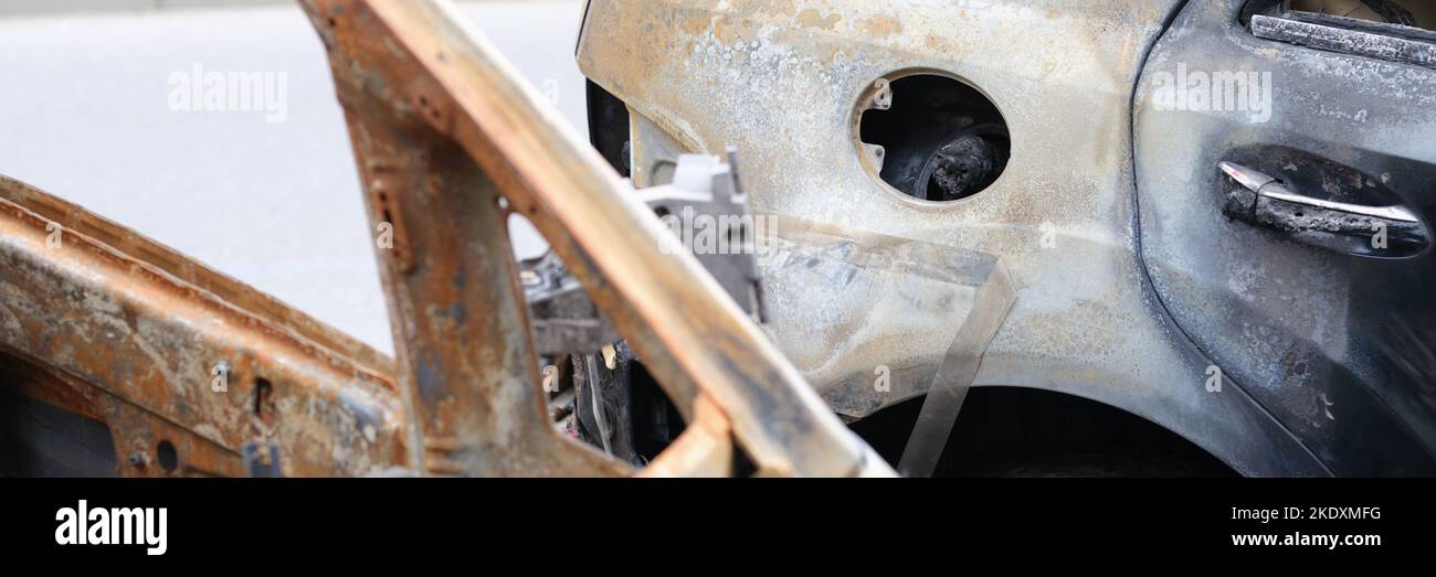Iron parts of burnt vehicle, cars after accident Stock Photo - Alamy