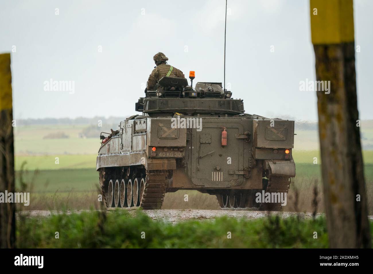 British army Warrior FV510 Fighting Vehicle crossing a sign posted road ...