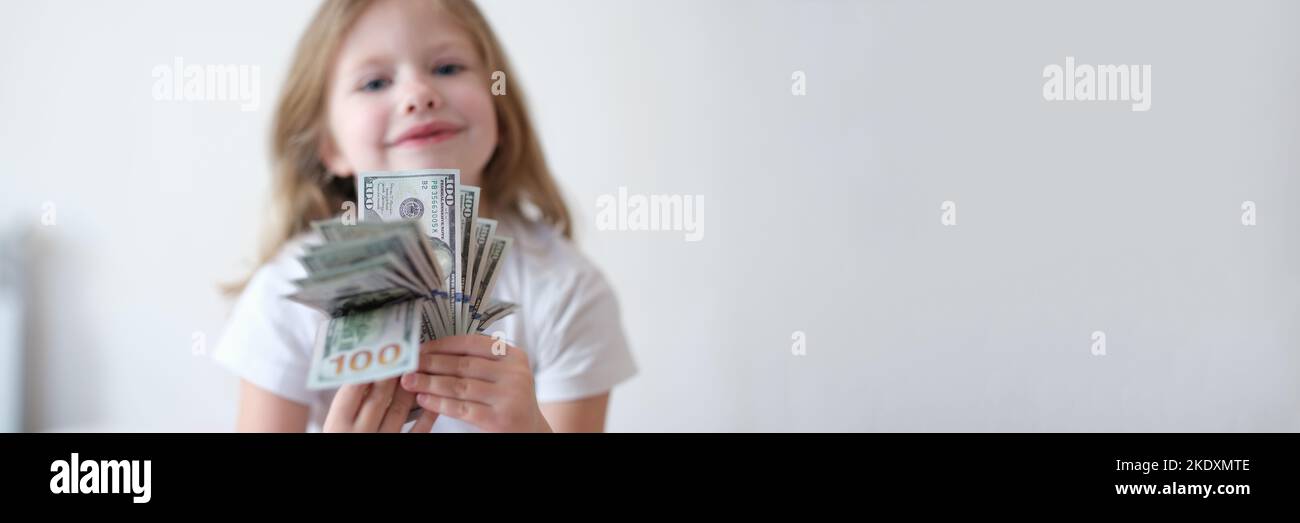 Little smiling girl counting money, happy childhood Stock Photo - Alamy