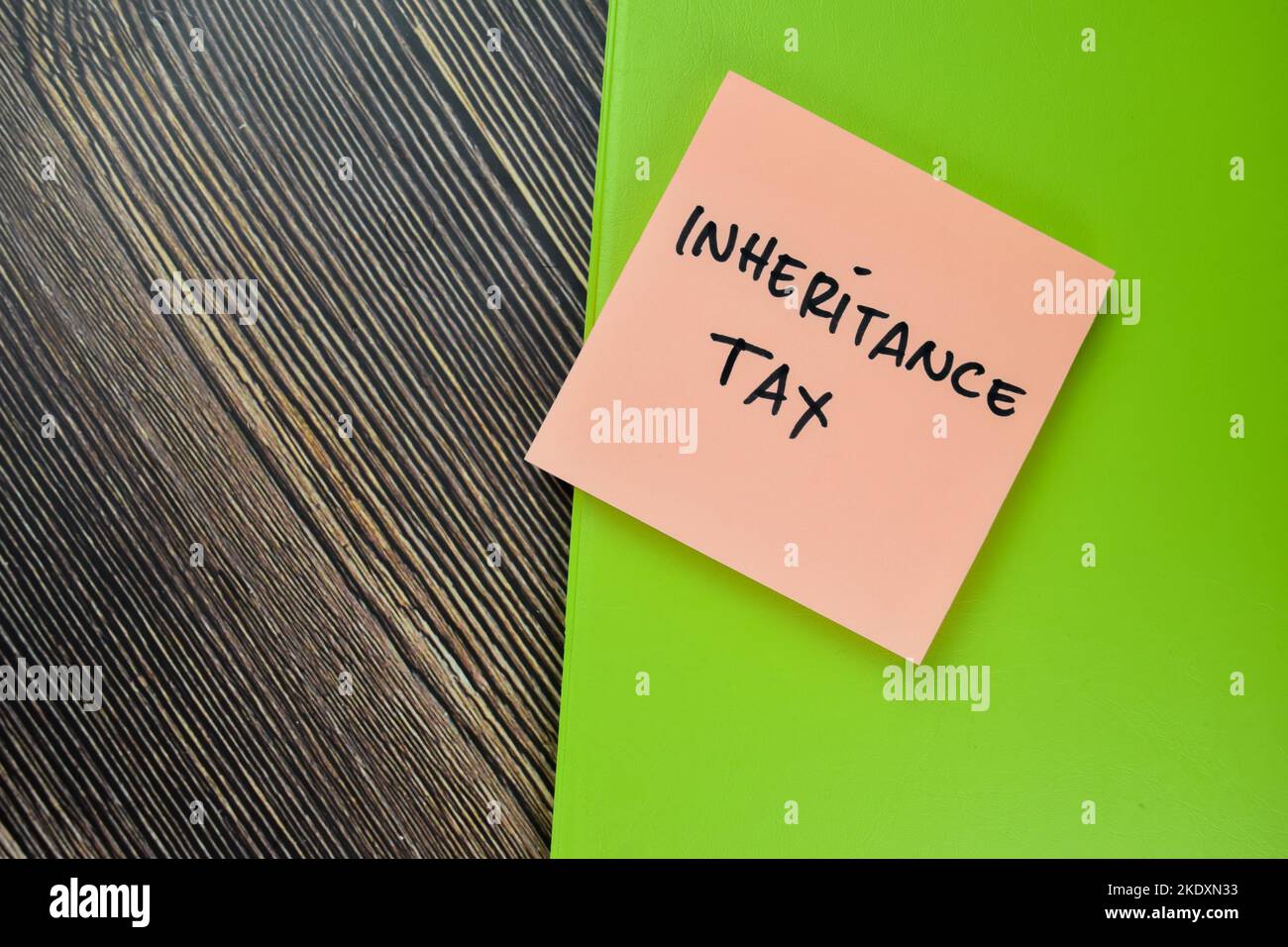 Concept of Inheritance Tax write on sticky notes isolated on Wooden ...