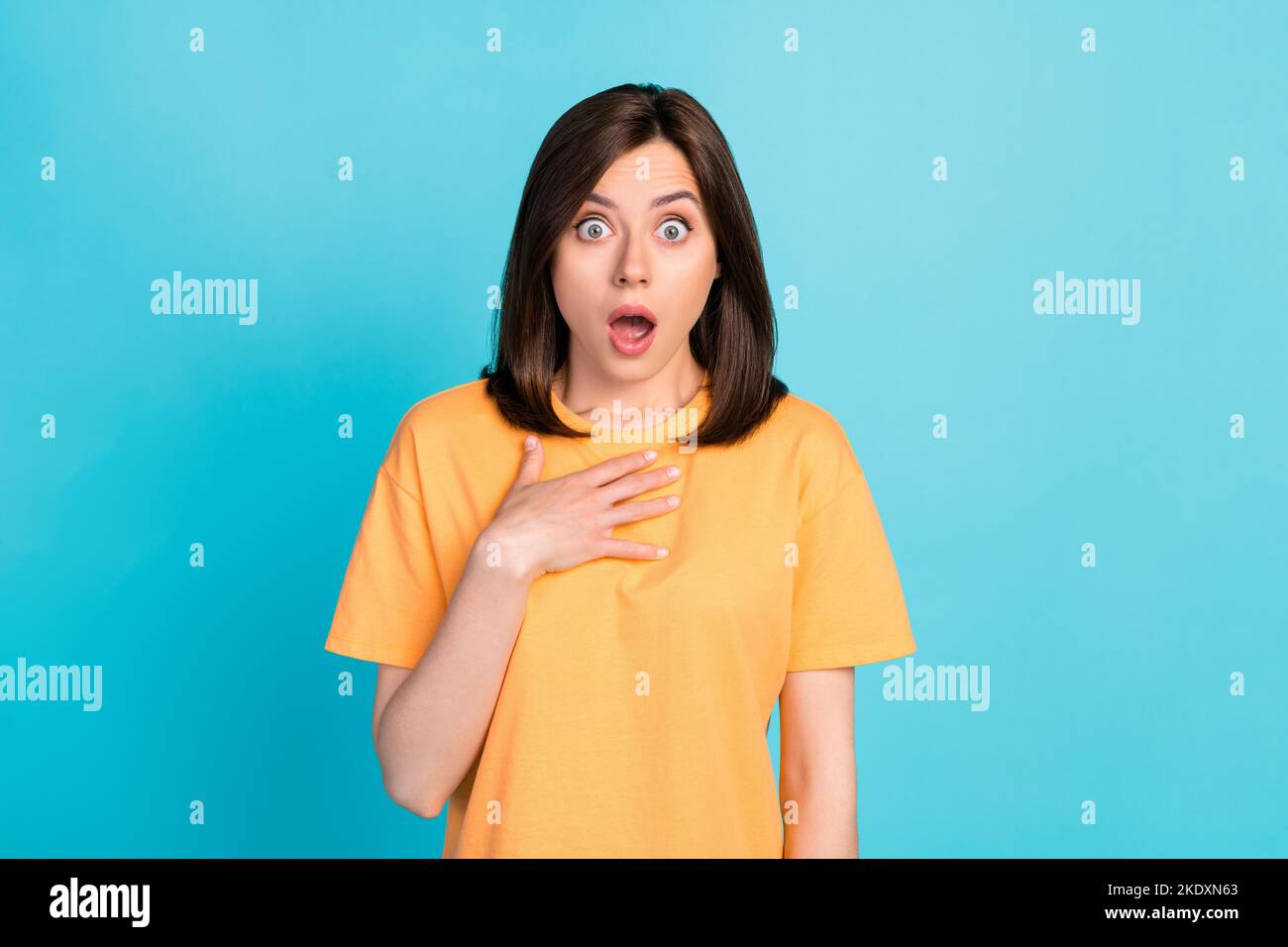 Photo of shocked young lady open mouth arm touch chest cant believe ...