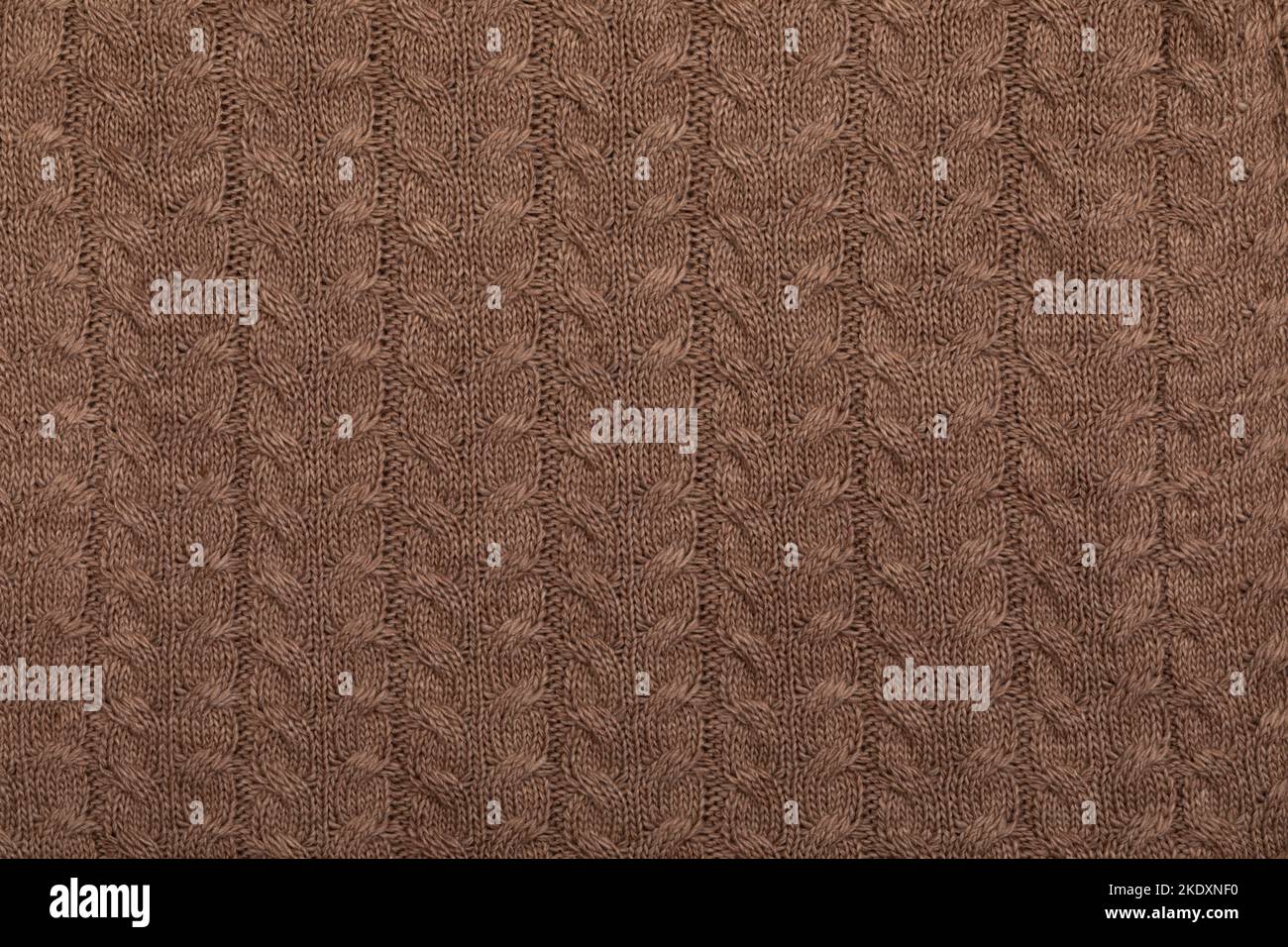 Real brown knitted fabric with cable pattern textured background Stock ...