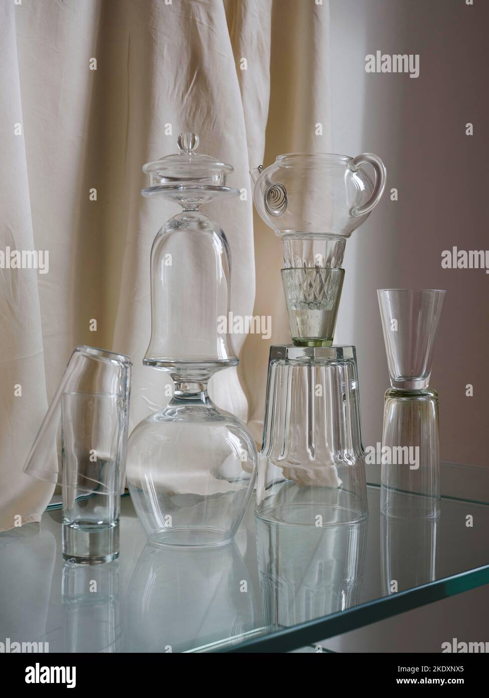 Collection of different glass shapes stacked in a balanced composition ...