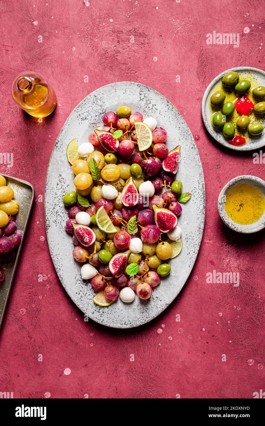 From above fresh ripe grapes, olives, figs and mozzarella seasonal ...