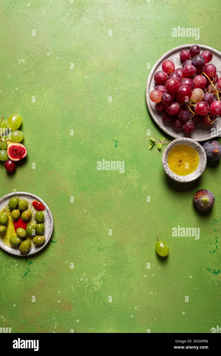 Top view of bunch of delicious fresh juicy red and green grapes served ...