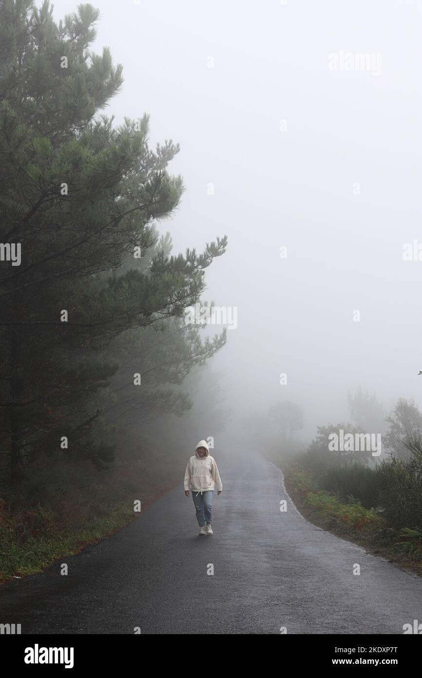 Woman outdoors in misty weather hi-res stock photography and images - Alamy